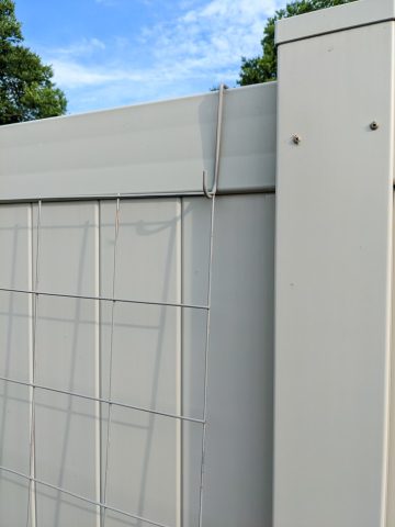 How I made a DIY wire trellis to hang on our vinyl fence