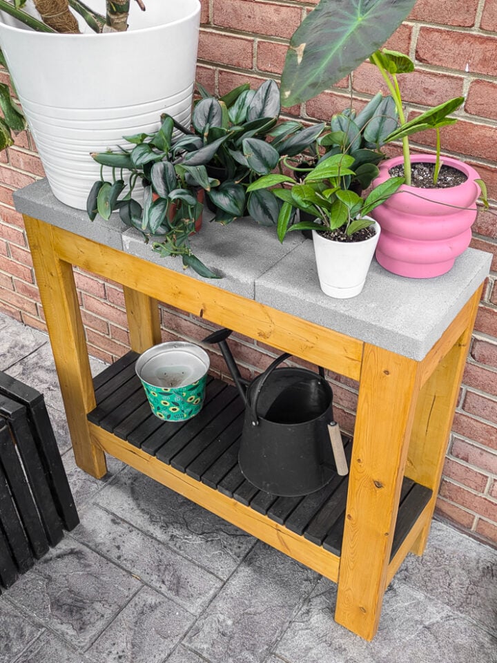 My outdoor console table made using 2x4s and pavers!
