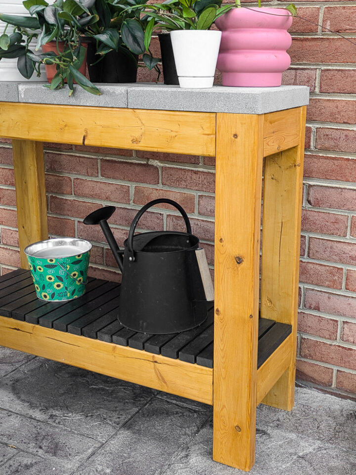 My outdoor console table made using 2x4s and pavers!