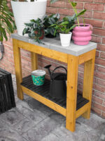 My outdoor console table made using 2x4s and pavers!